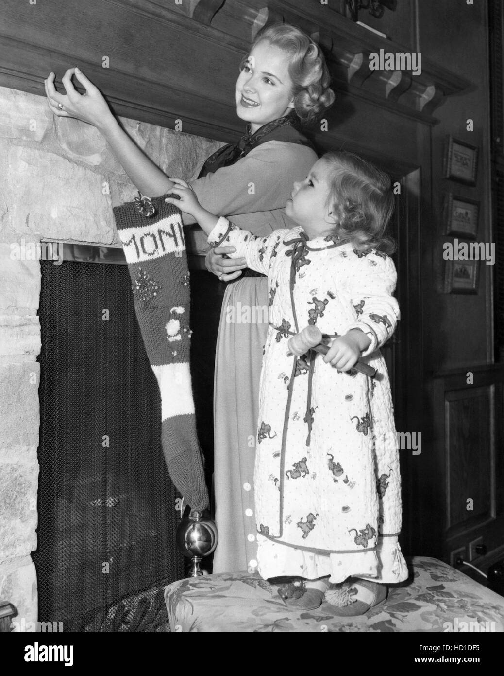 From left: Mona Freeman with her daughter, Monie Ellis, hanging ...