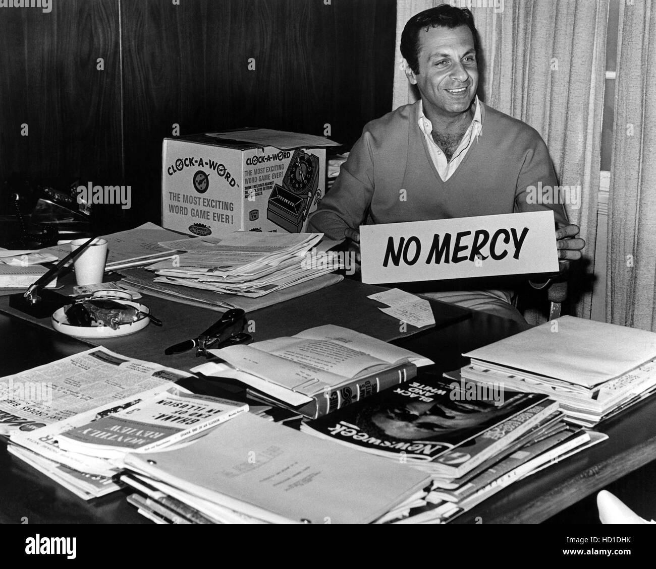 Mort Sahl, holding a no mercy sign, ca. 1966-1967 Stock Photo - Alamy