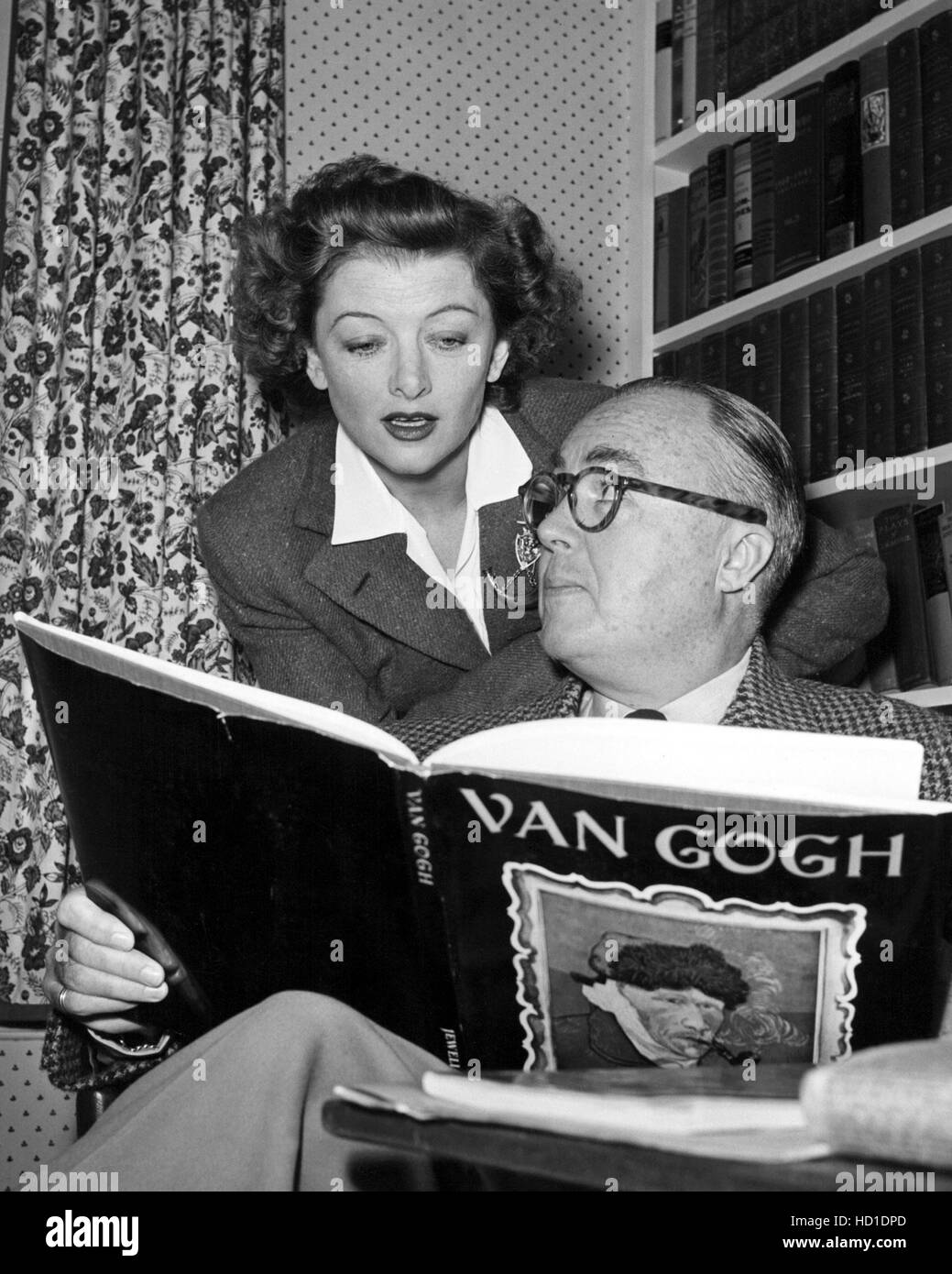 MYRNA LOY and husband GENE MARKEY enjoy a book on Van Gogh, 1947 Stock ...