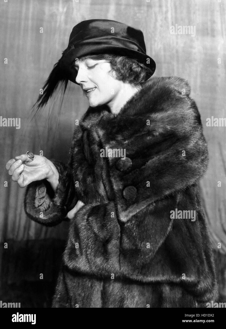 Silent movie star Dorothy Dalton checks the time on her new-fangled ...