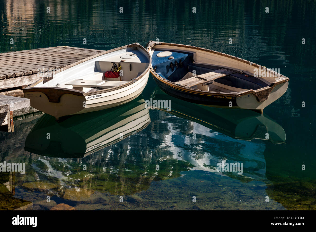 Two row boats moored at the dock on Lake O'Hara, Yoho National Park, British Columbia, Canada ...