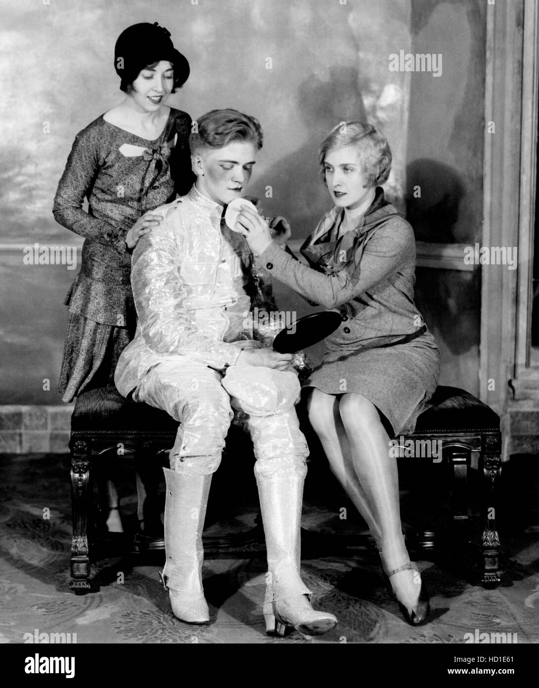 Doris Eaton, (left), Mary Eaton, making up their brother, Joseph Eaton ...