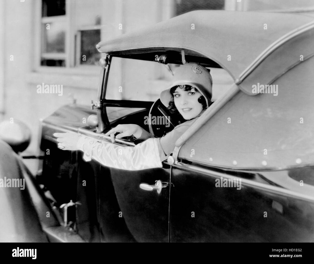 Dorothy Janis, modeling a rubber sleeve to protect her clothing from ...