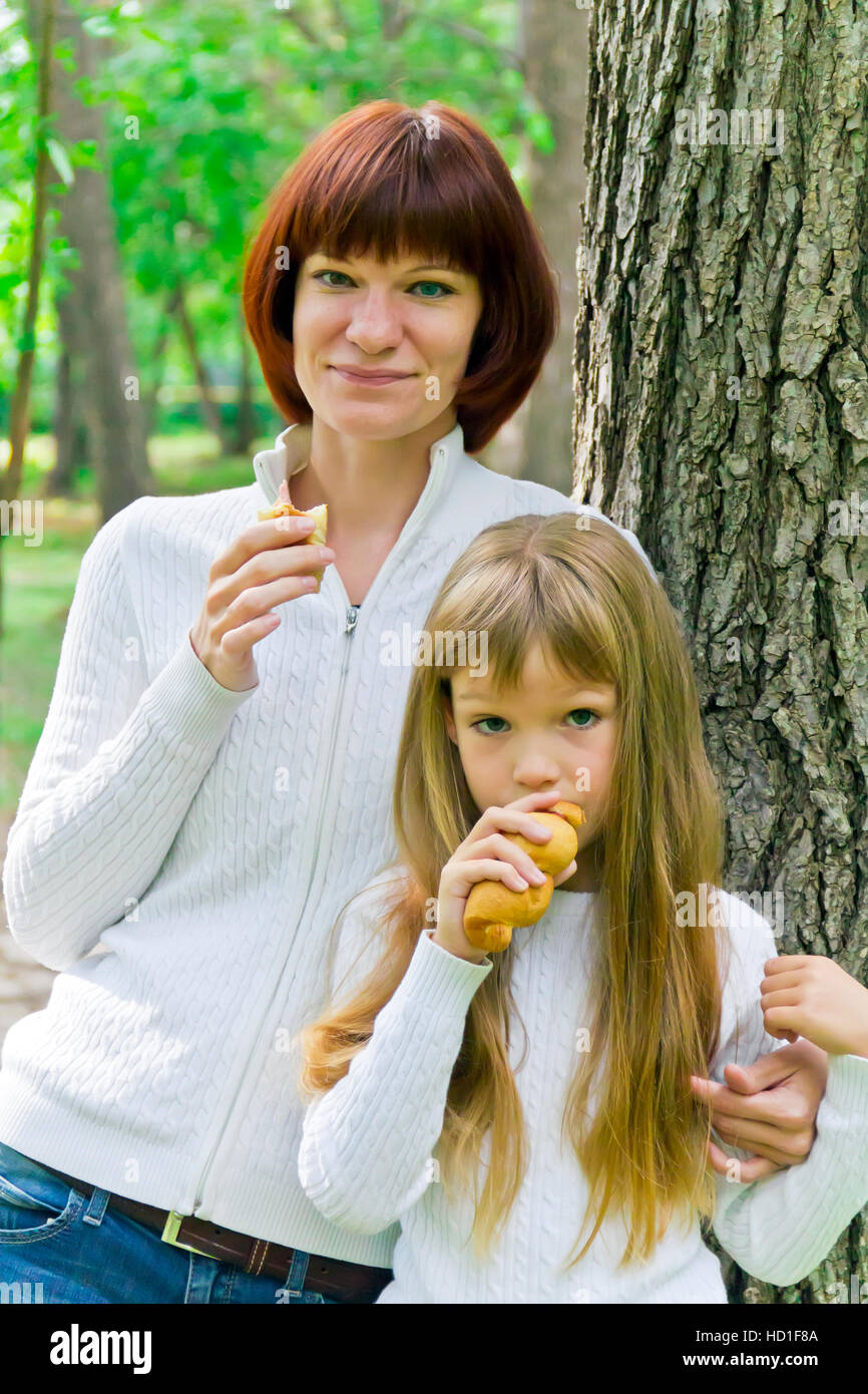 Photo of mother and daughter are eating Stock Photo - Alamy