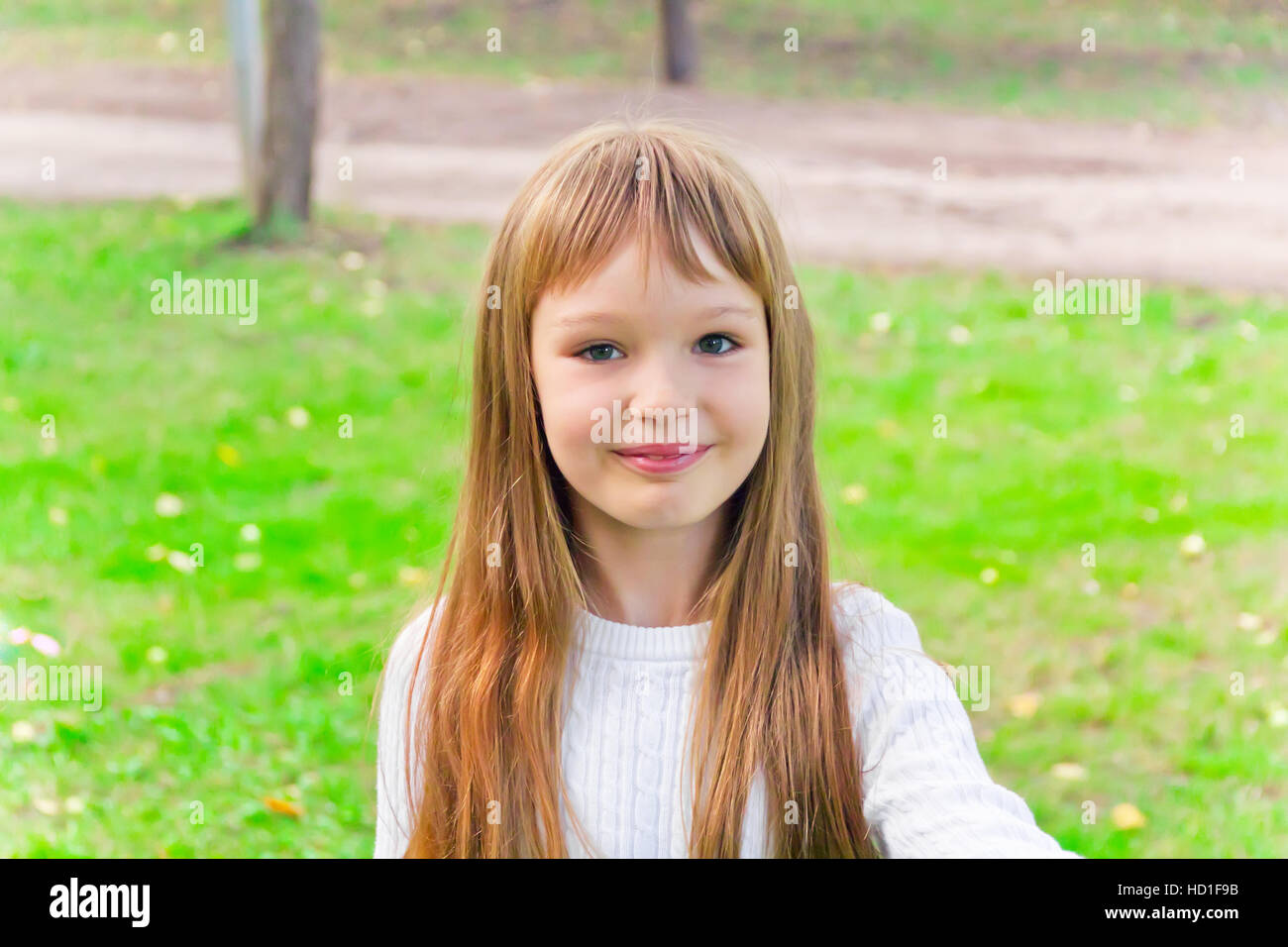 Photo of cute girl with long hair Stock Photo - Alamy