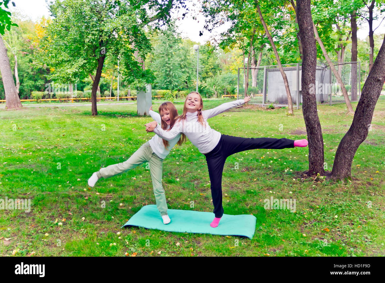 Two girls playing in play hi-res stock photography and images - Alamy