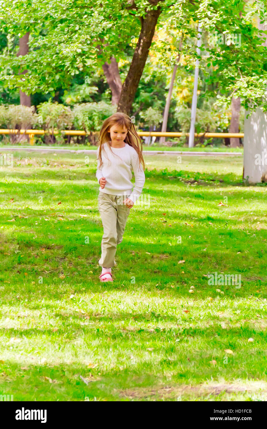 Photo of cute running girl in summer Stock Photo - Alamy