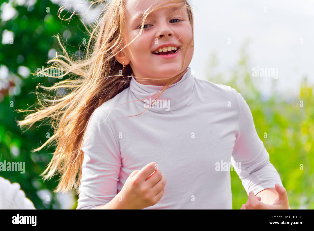 Photo of cute running girl in summer Stock Photo - Alamy