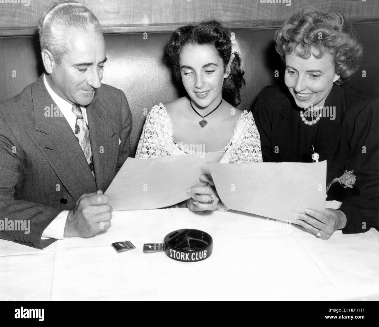 Elizabeth Taylor, center, at the Stork Club with her parents, Francis ...
