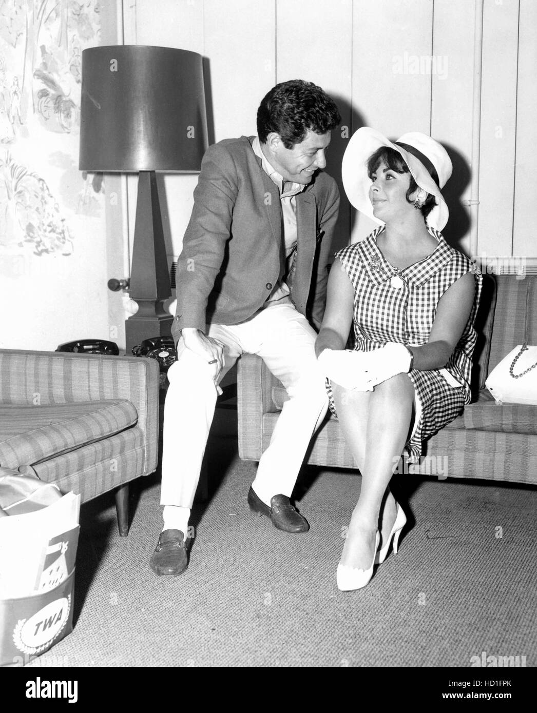 From left, Eddie Fisher, Elizabeth Taylor, en route to Rome, where she ...
