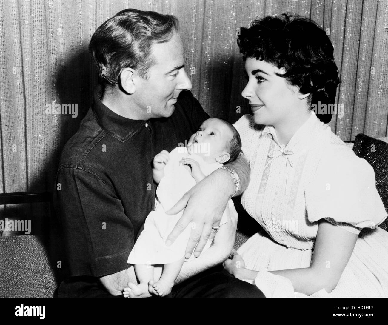 From left, Michael Wilding, Elizabeth Taylor, with their son Michael ...