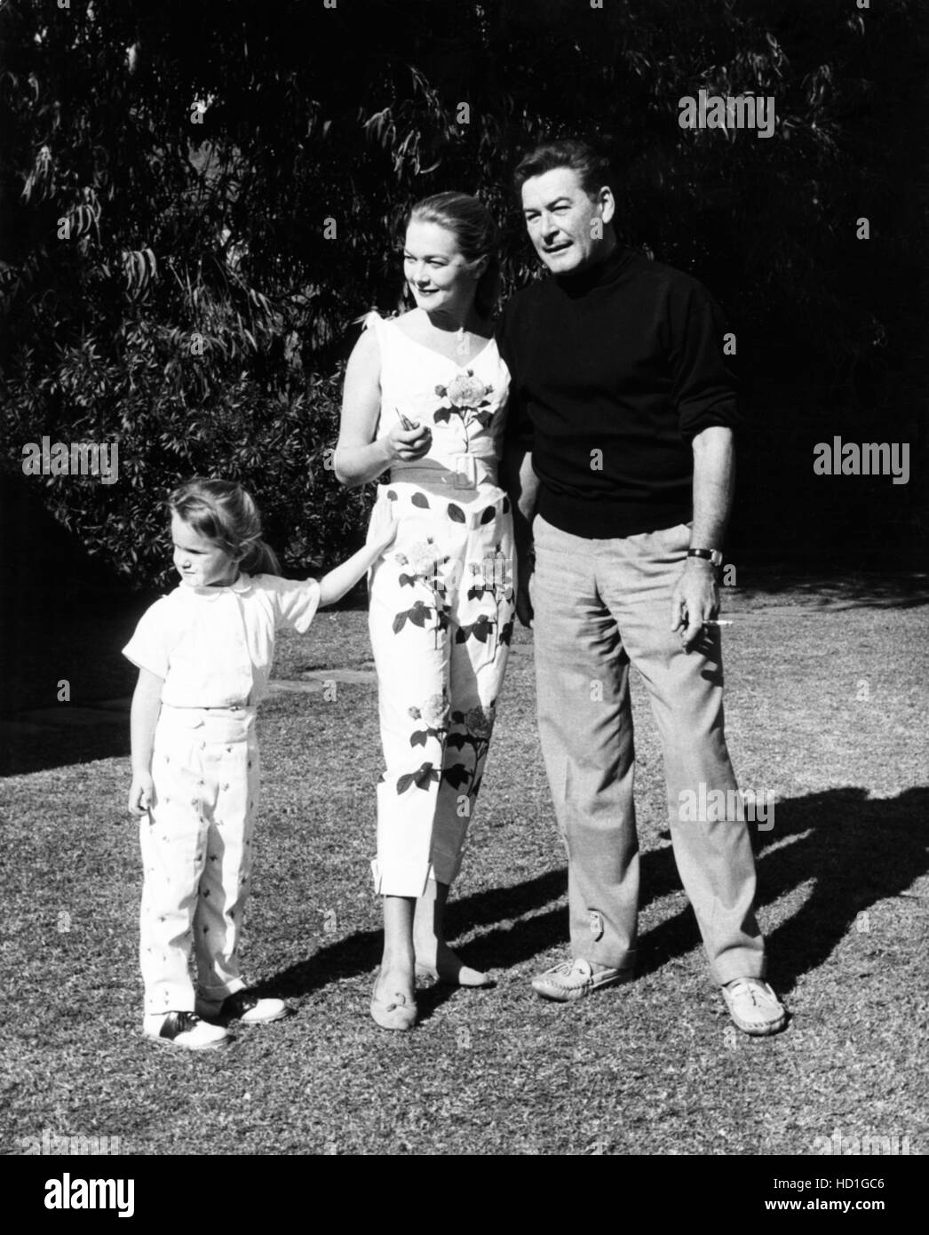 Errol Flynn (right) at home with wife Patricie Wymore (center) and ...