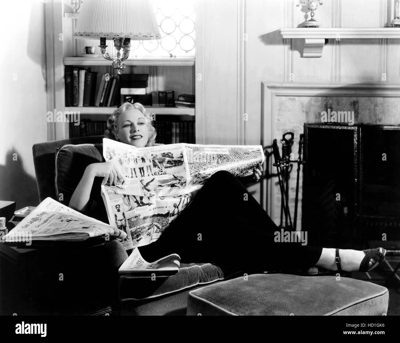 Esther Ralston, enjoying the rotogravure section of the Los Angeles ...