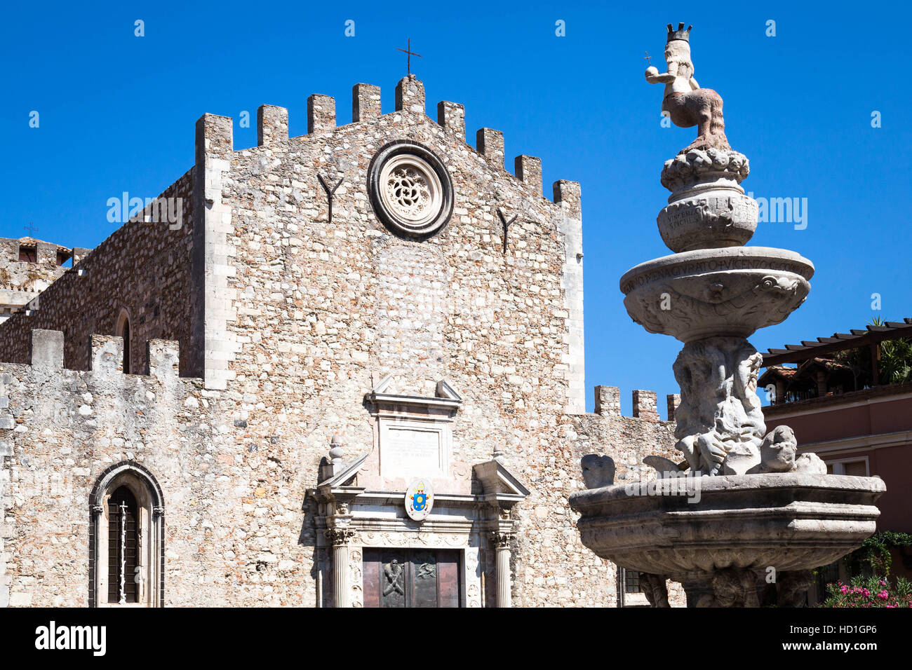 A view of the Fortress Duomo and fountain in Taormina, Sicily Stock ...