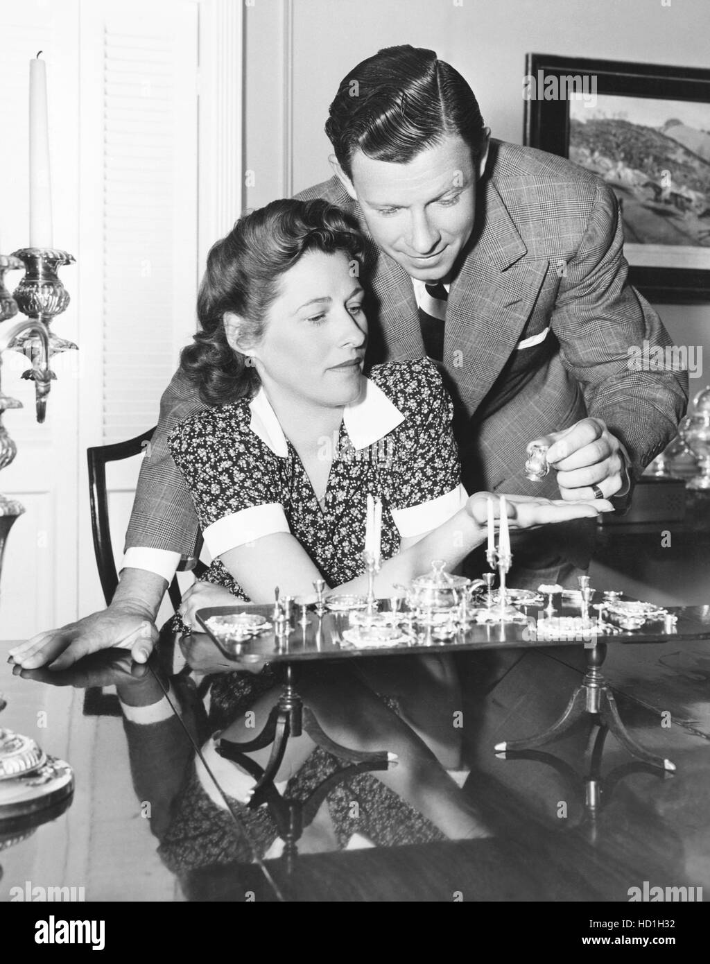George Murphy (right) examines a silver pitcher from wife Julie Johnson ...