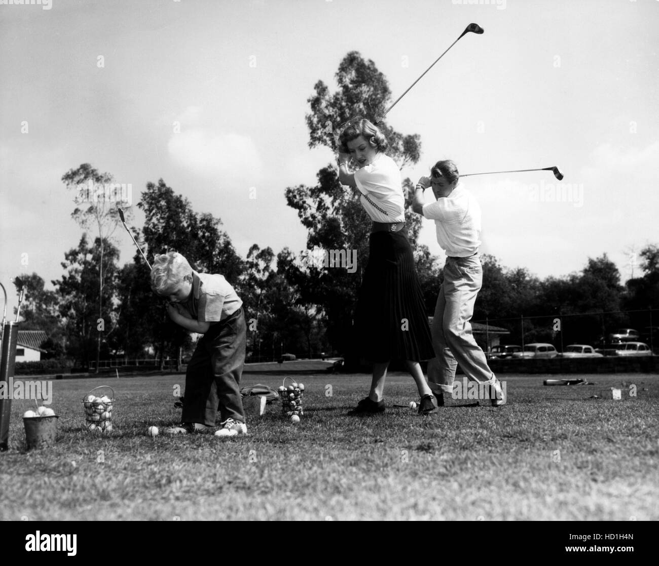 From left: Christoper Nelson playing golf with mother Miriam Franklin ...