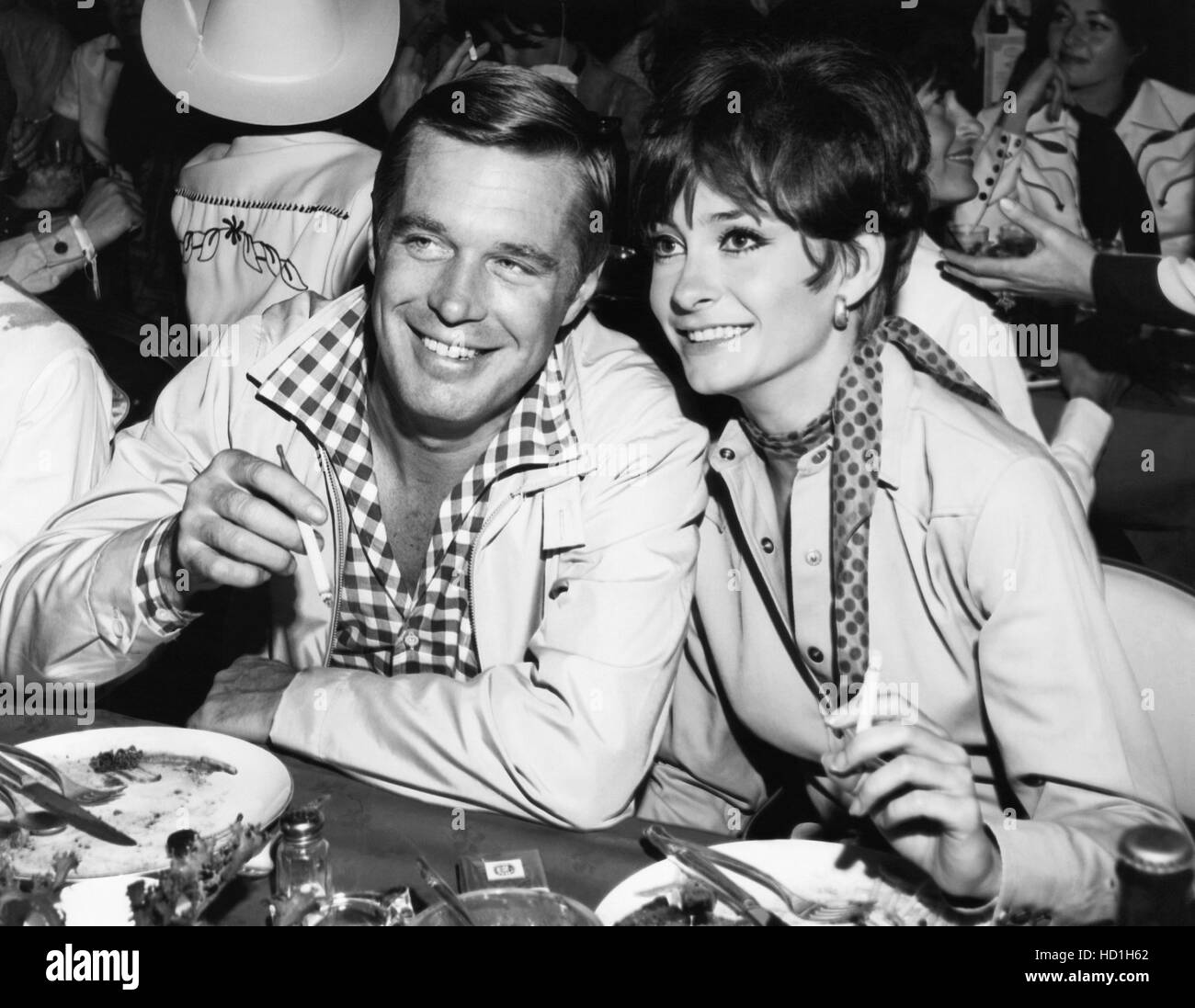 From left, spouses George Peppard, Elizabeth Ashley, ca. late 1960s ...