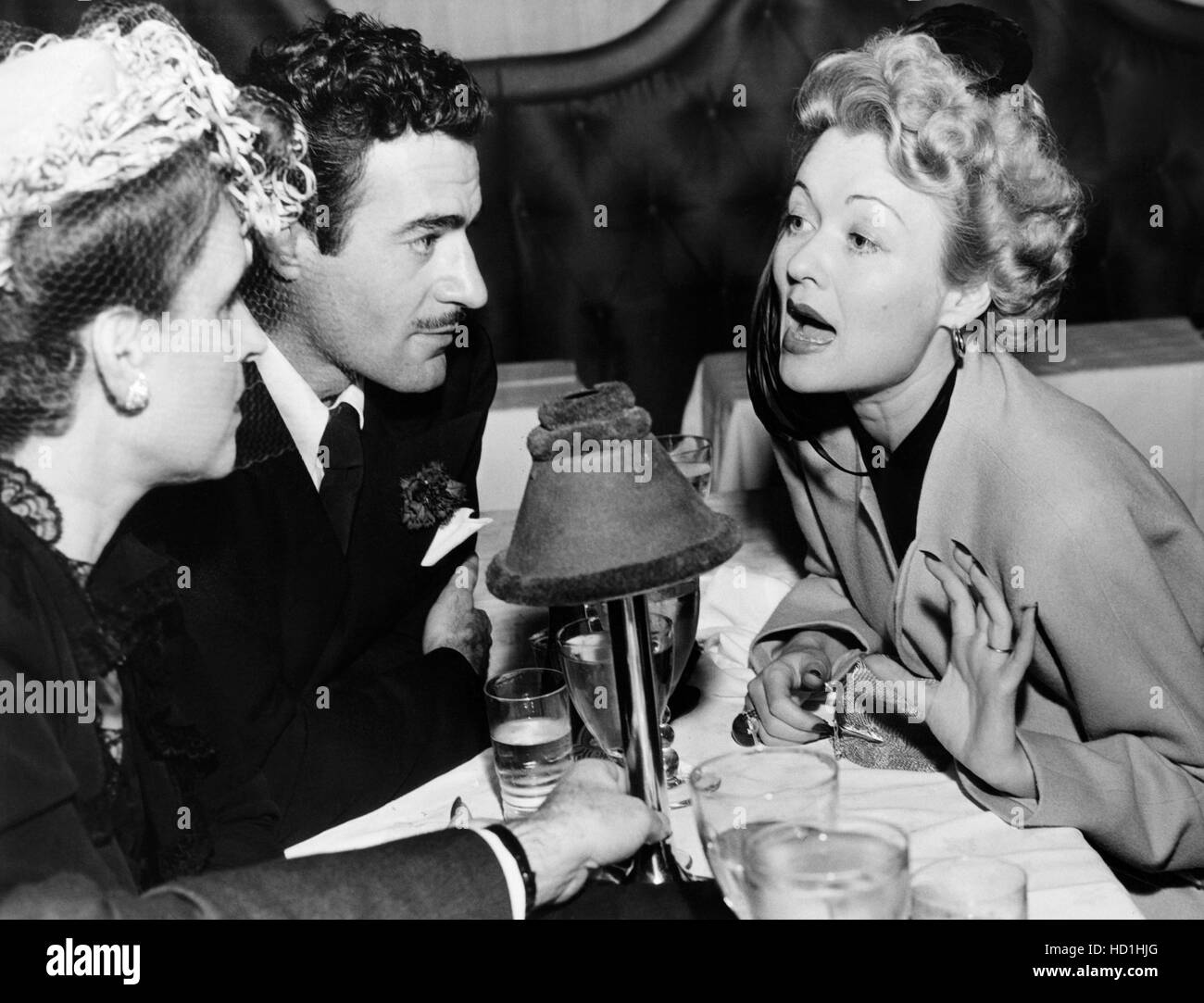 Rear from left: Gilbert Roland, Constance Bennett at Ciro's, 1942 Stock ...