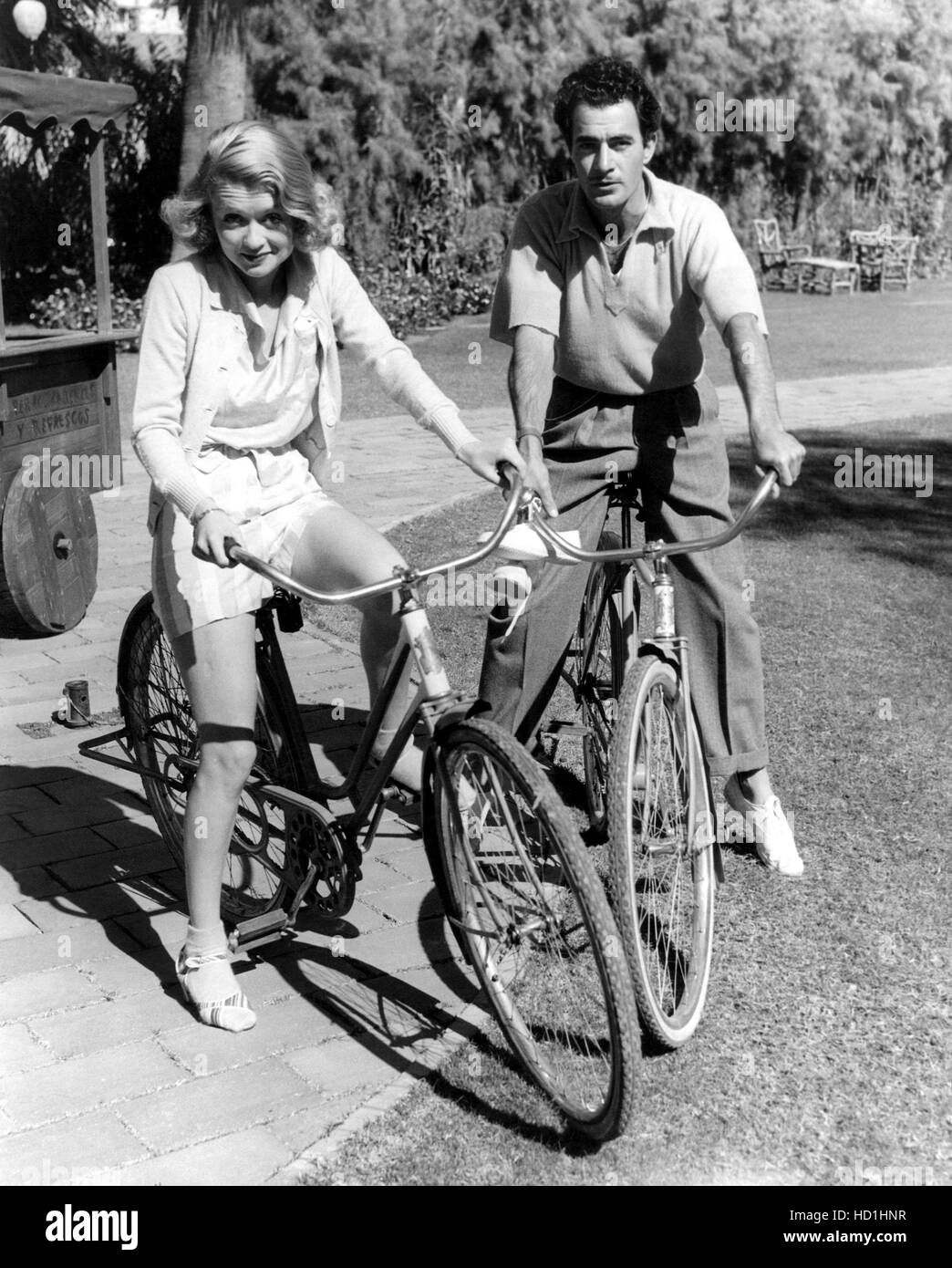 From left: Constance Bennett, husband Gilbert Roland bicycle riding ...