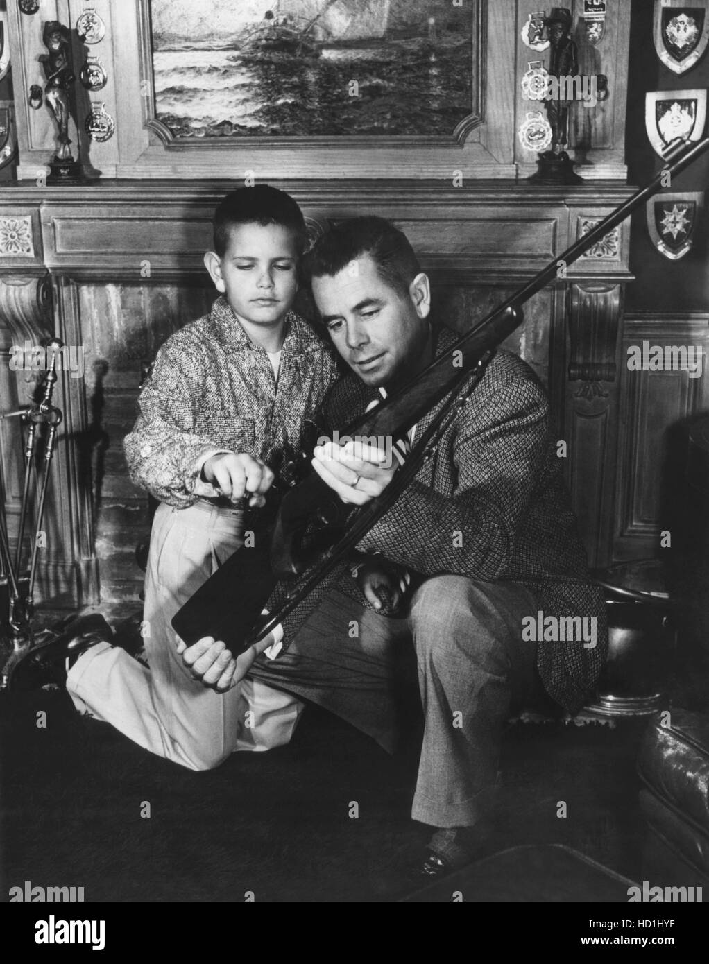 Glenn Ford (right) showing his son Peter Ford the finer points of the ...