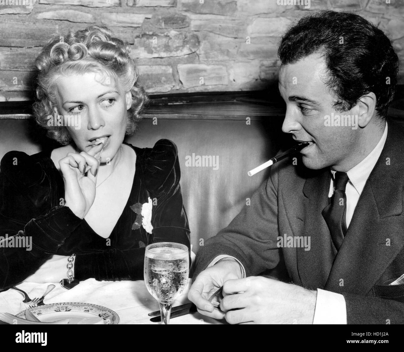 From left: Gladys George with third husband, Leonard Penn, at Cafe Lamage, ca. 1940 Stock Photo ...