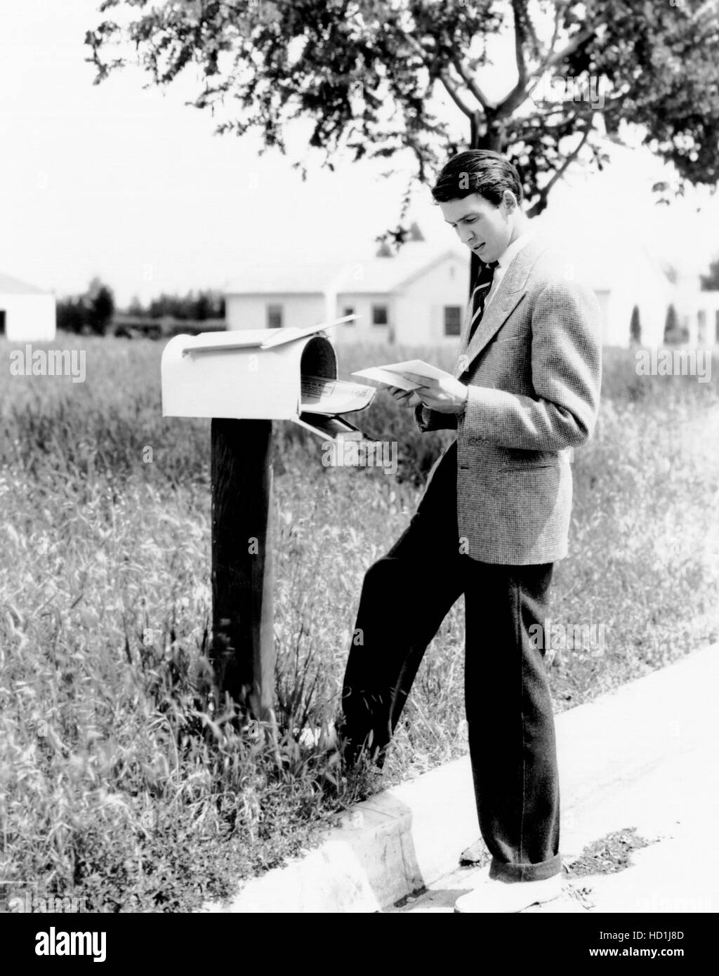 James Stewart checking the contents of his mailbox, late 1930s Stock ...