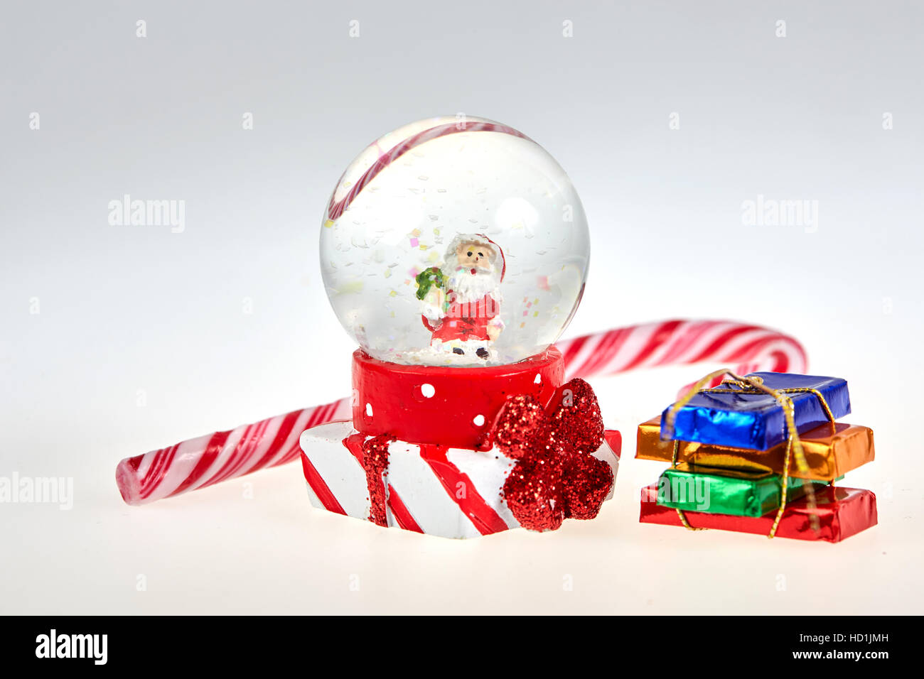 Candy stick christmas red balls isolated Stock Photo - Alamy