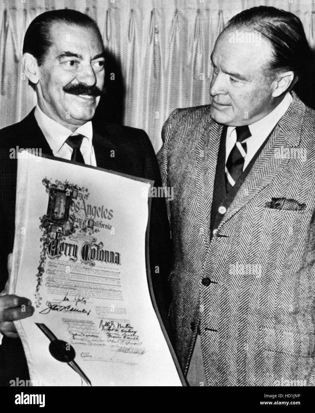 Jerry Colonna (left) is given a citation from the City of Los Angeles ...