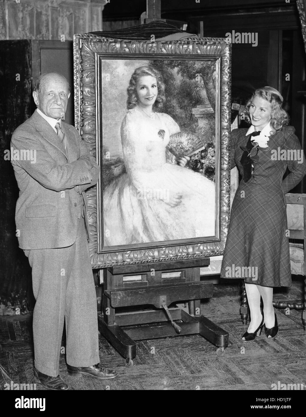 Singer Jessica Dragonette, right, accepts a painting of herself from ...