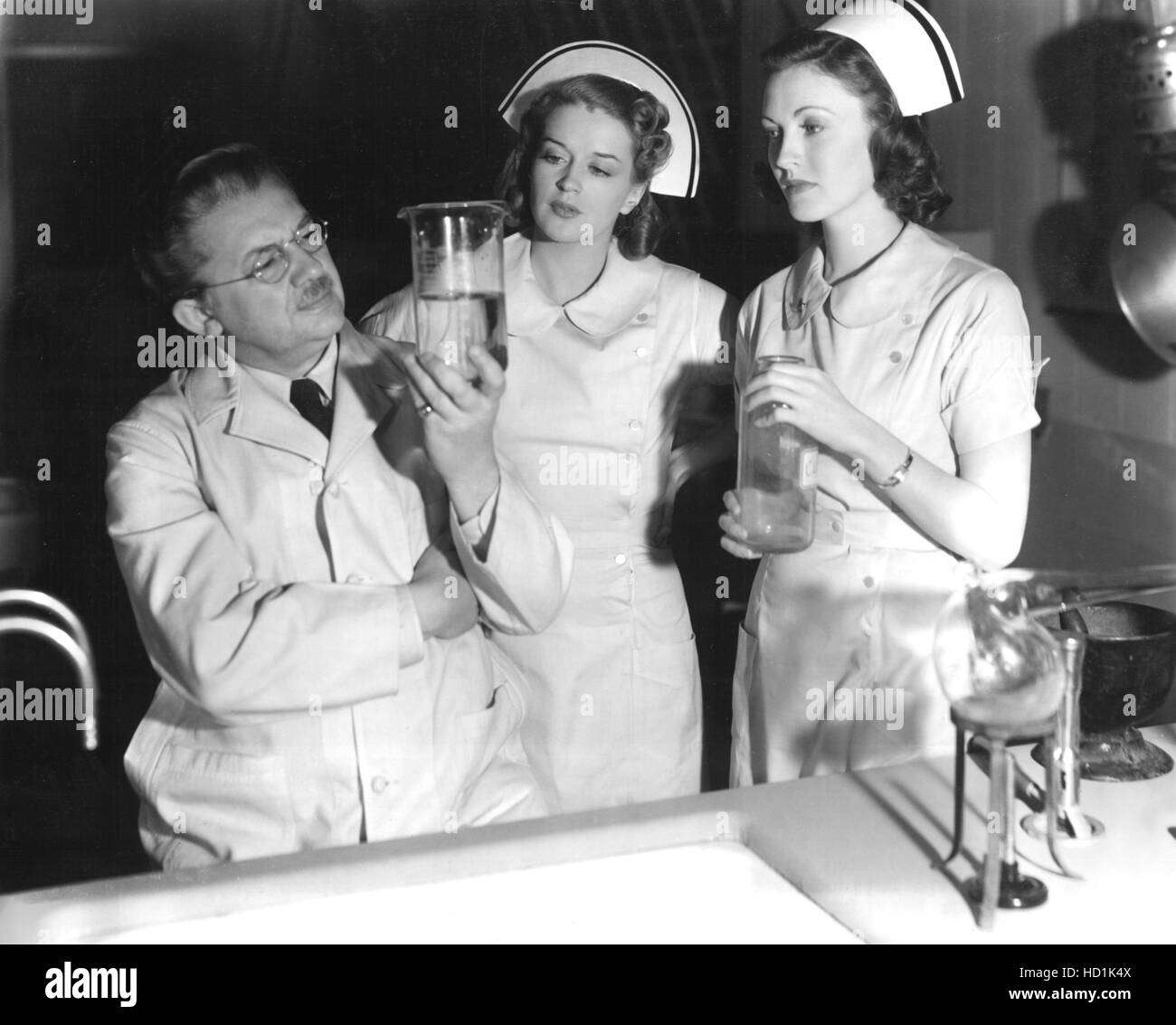 JEAN HERSHOLT shows off the results of his experiment to his radio ...