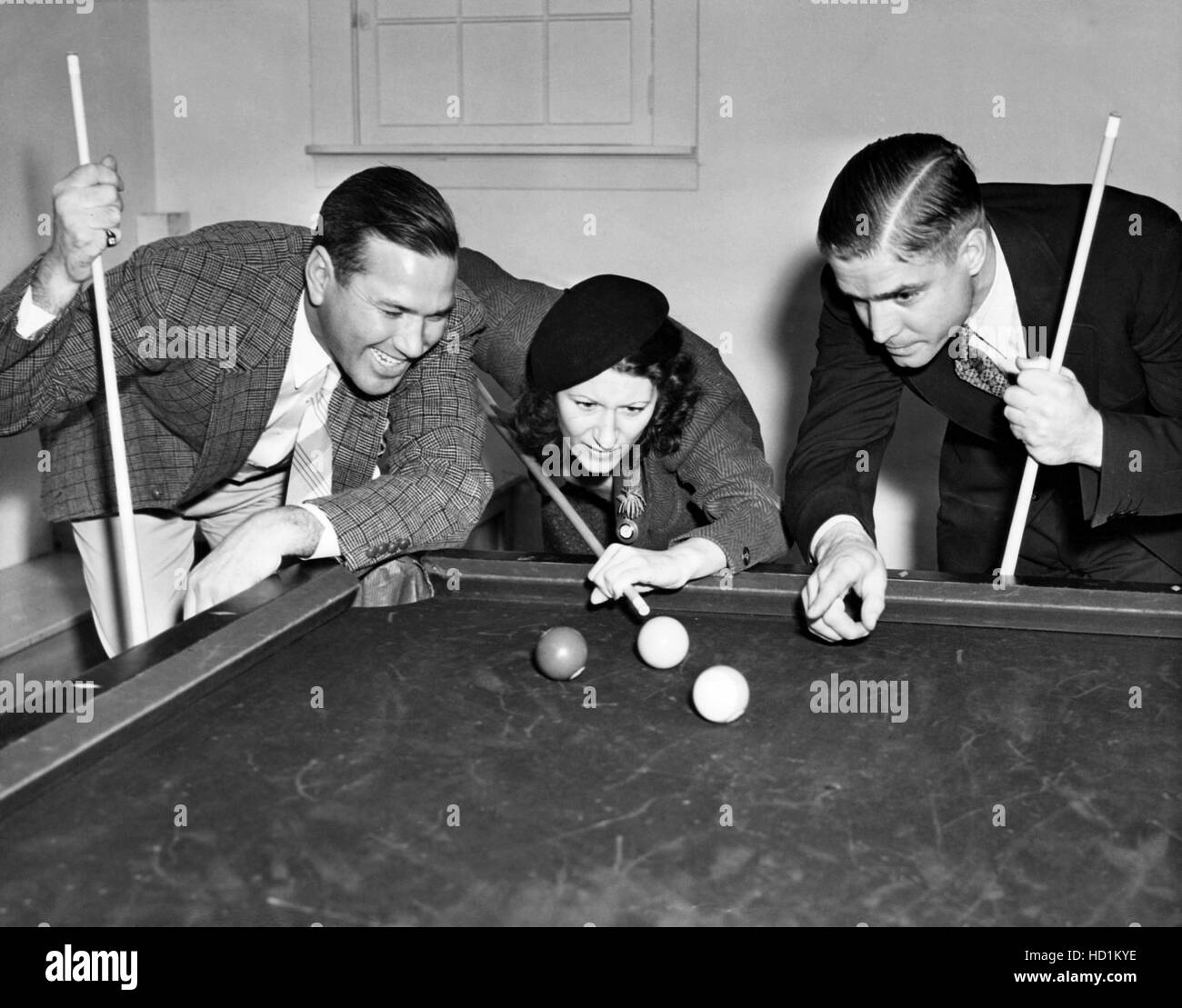 From left: Dizzy Dean, Joan Davis, Robert Garbark, playing pool ...