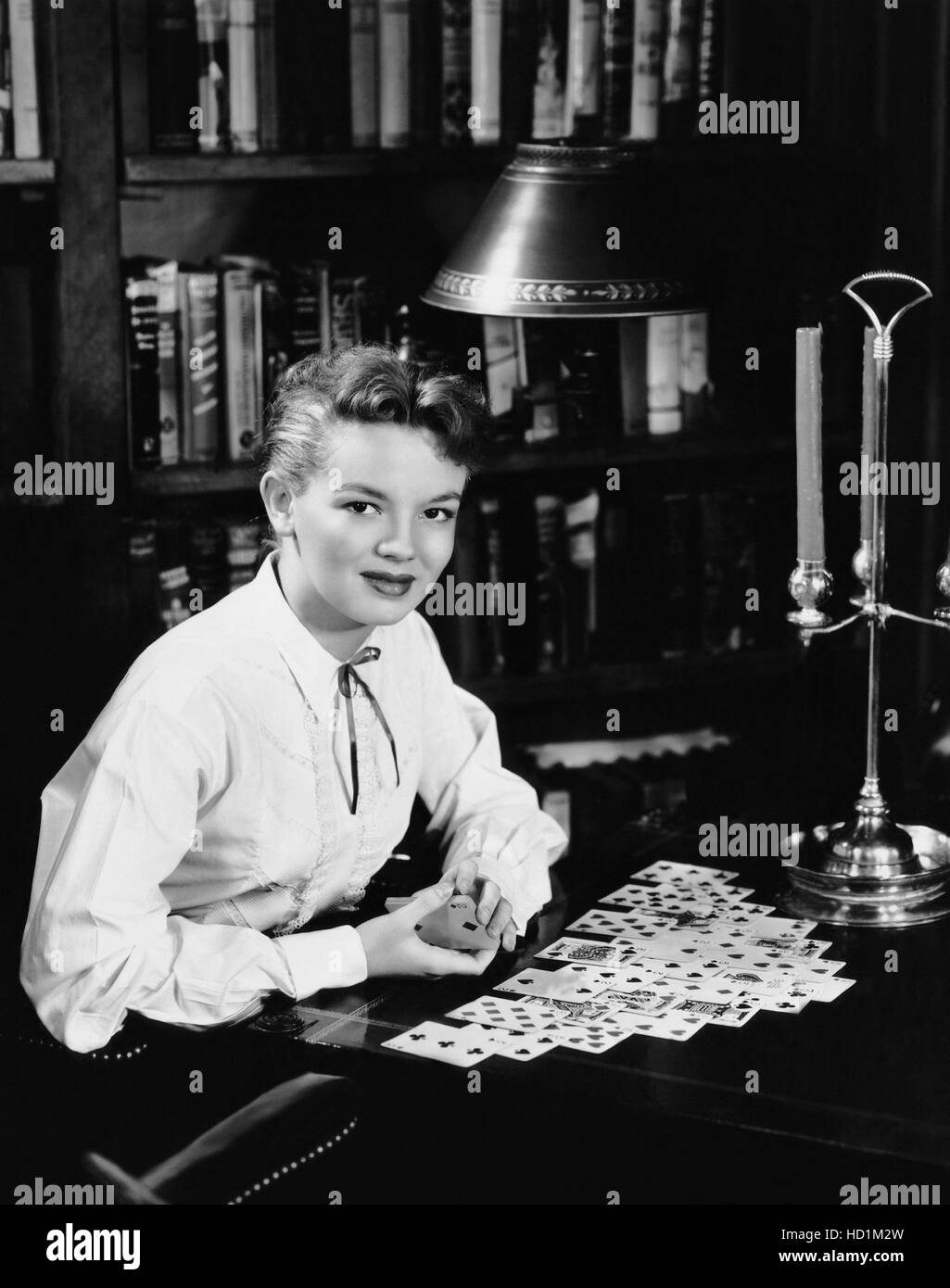Goldwyn starlet Joan Evans plays solitaire, 1949 Stock Photo - Alamy