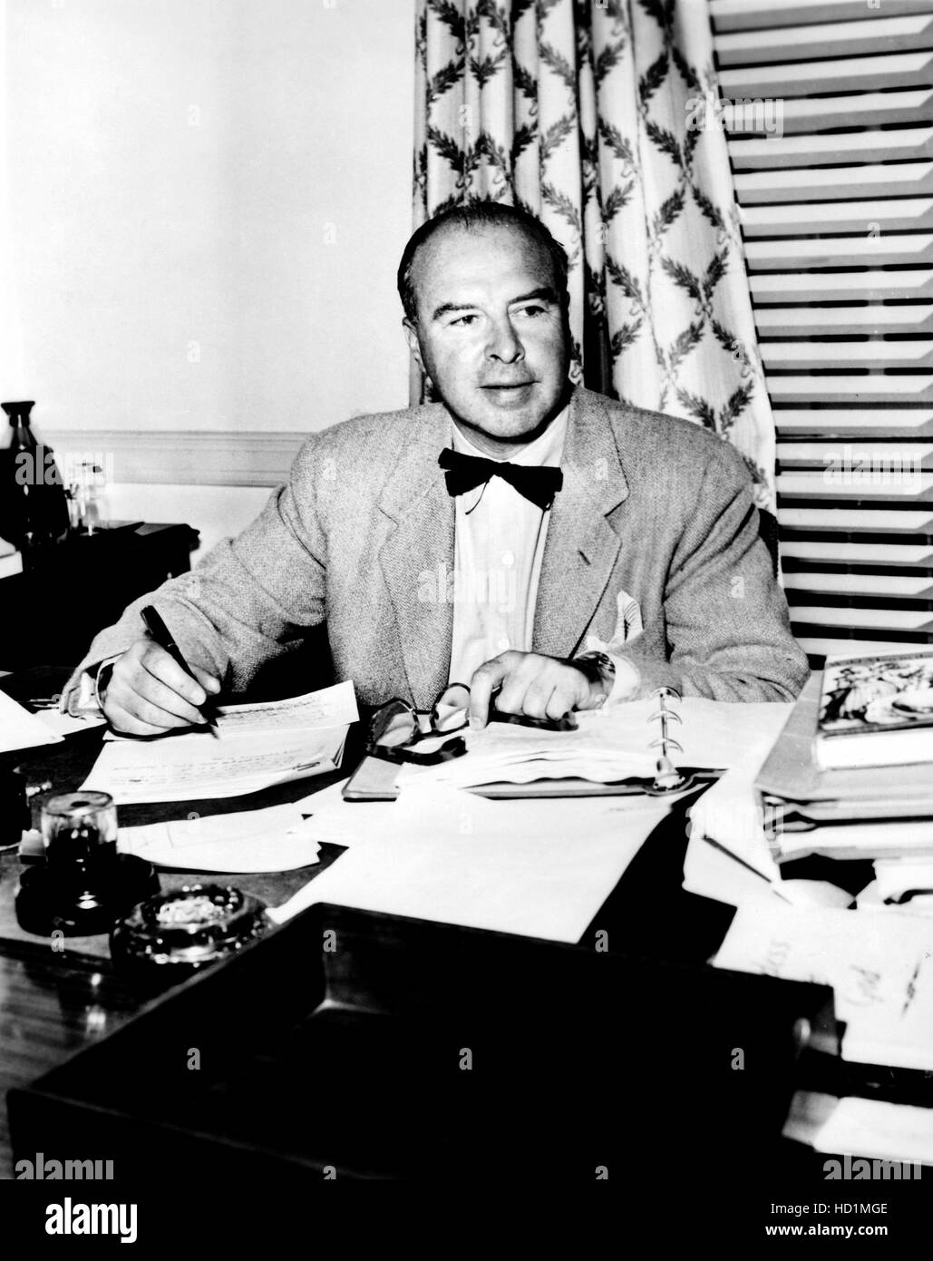 John Houseman at MGM studio office, 1956 Stock Photo - Alamy