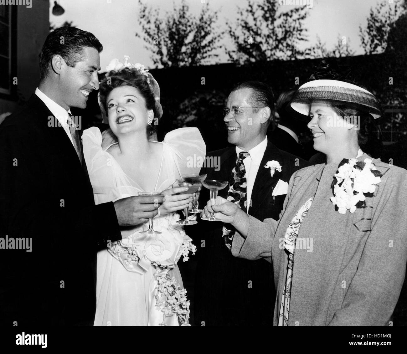 From left: groom and bride John Hodiak and Anne Baxter toasted by the ...
