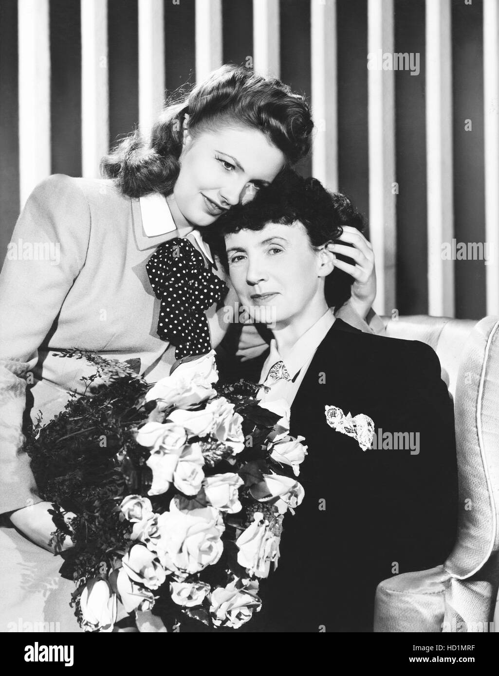Joan Leslie (left) presents her mother, Mrs. John Brodel, with a ...