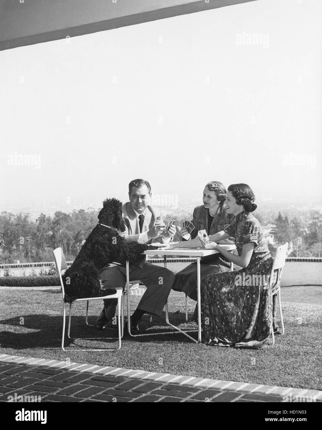 From left, Beau the poodle, Johnny Mack Brown, his wife, Cornelia Brown, and their daughter ...
