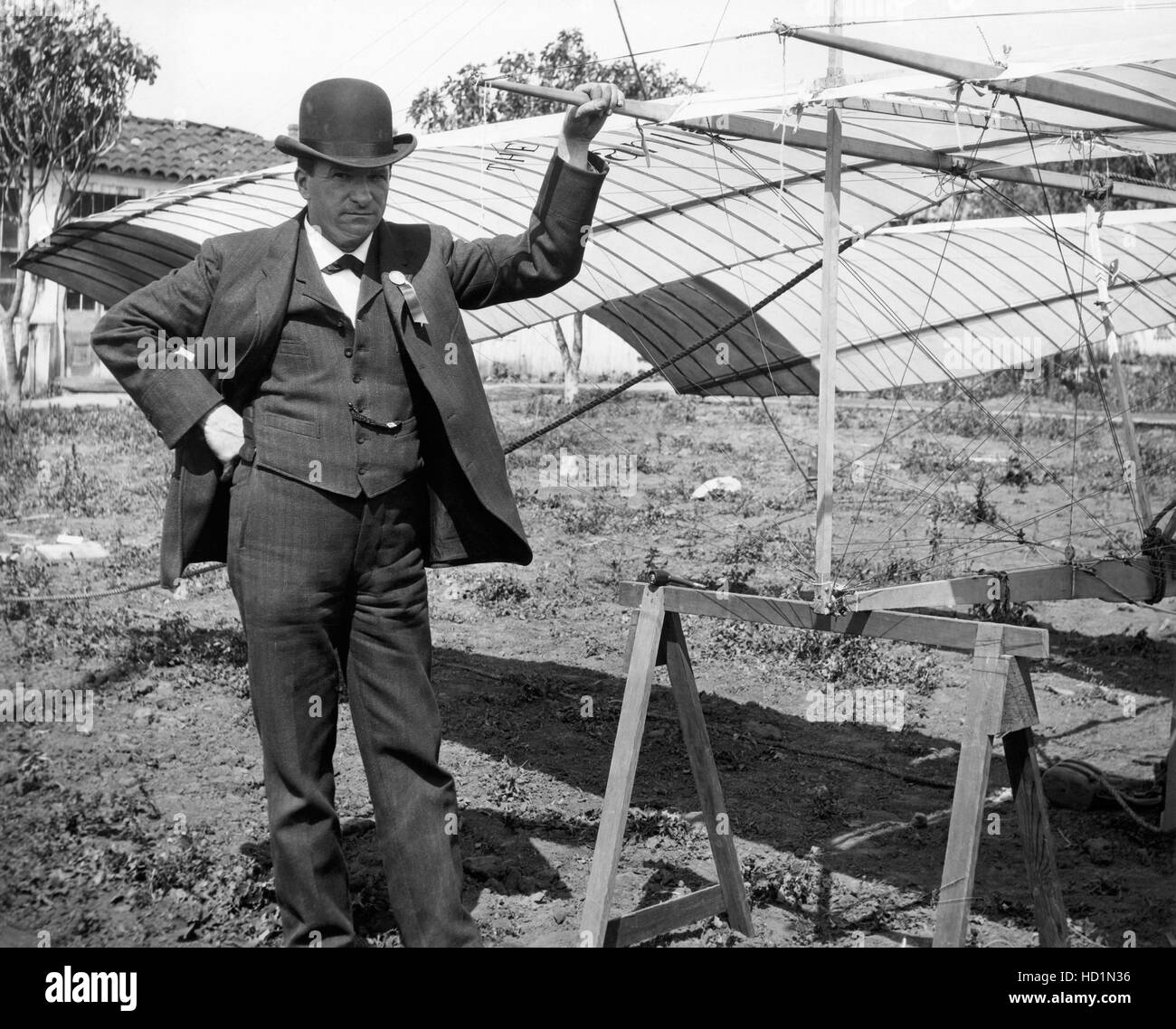 Aviation pioneer, John J. Montgomery standing next to his invention ...