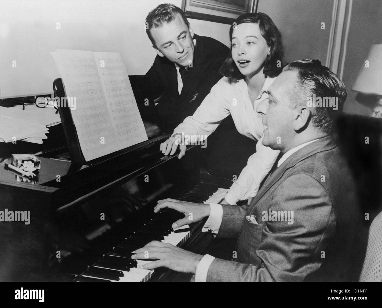 LESLIE CARON, with composers Alan J. Lerner (left) and Frederick Lowe ...