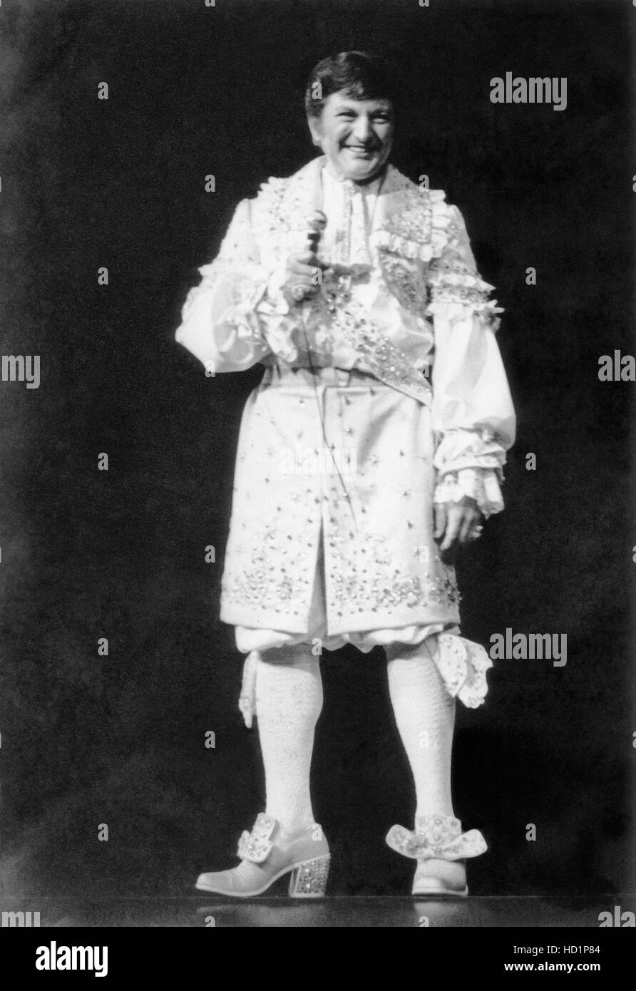 Liberace, performing at the Las Vegas Hilton, in a $7,500 pink and ...