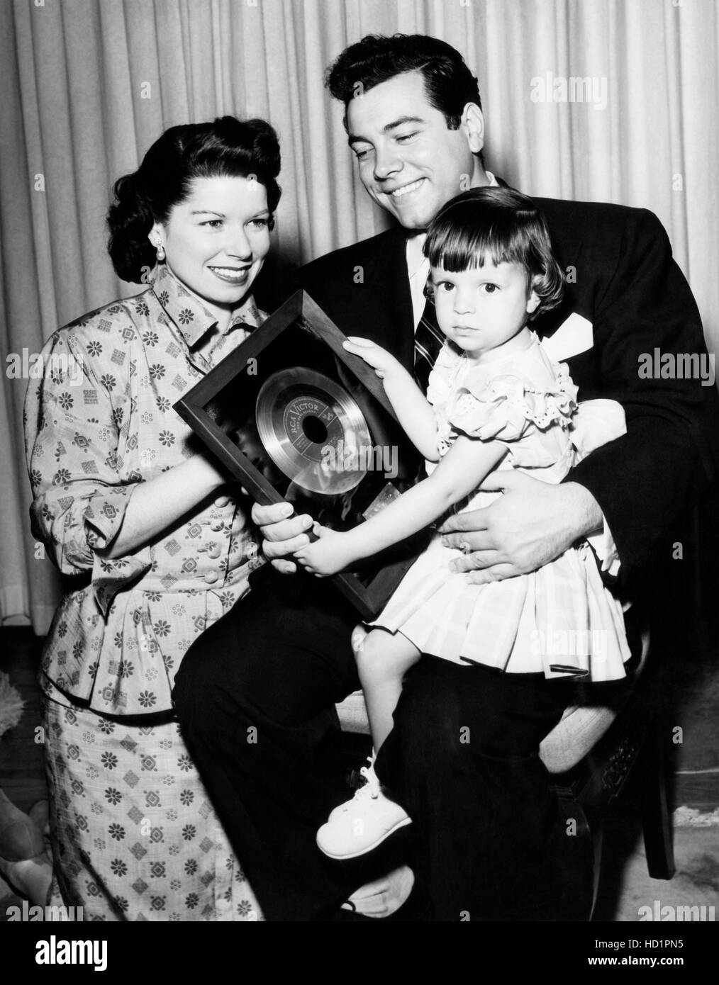 Mario Lanza, with his wife Betty and their daughter Colleen, accepting ...