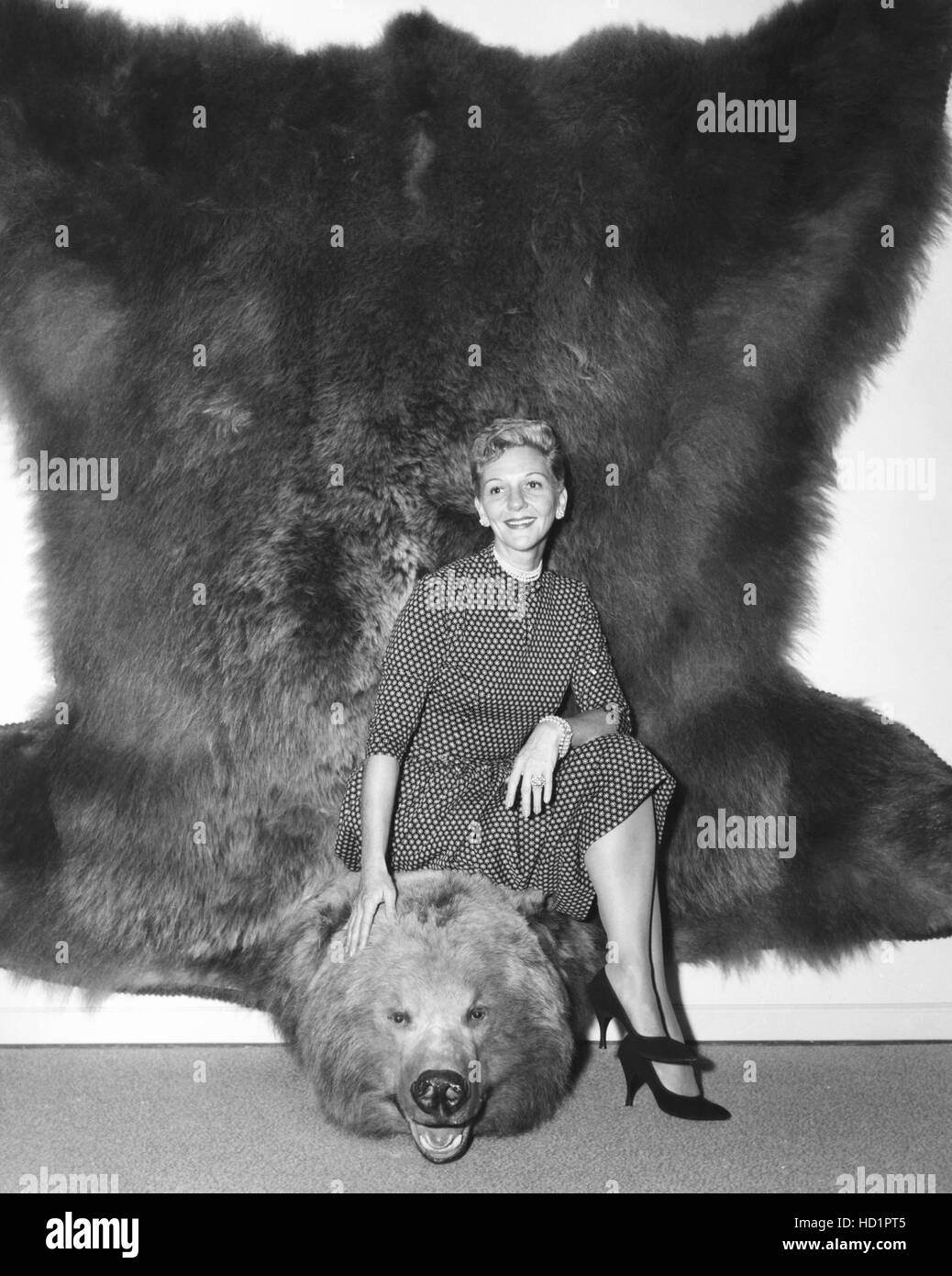 Mary Martin, who is appearing in ANNIE GET YOUR GUN, poses with a ...