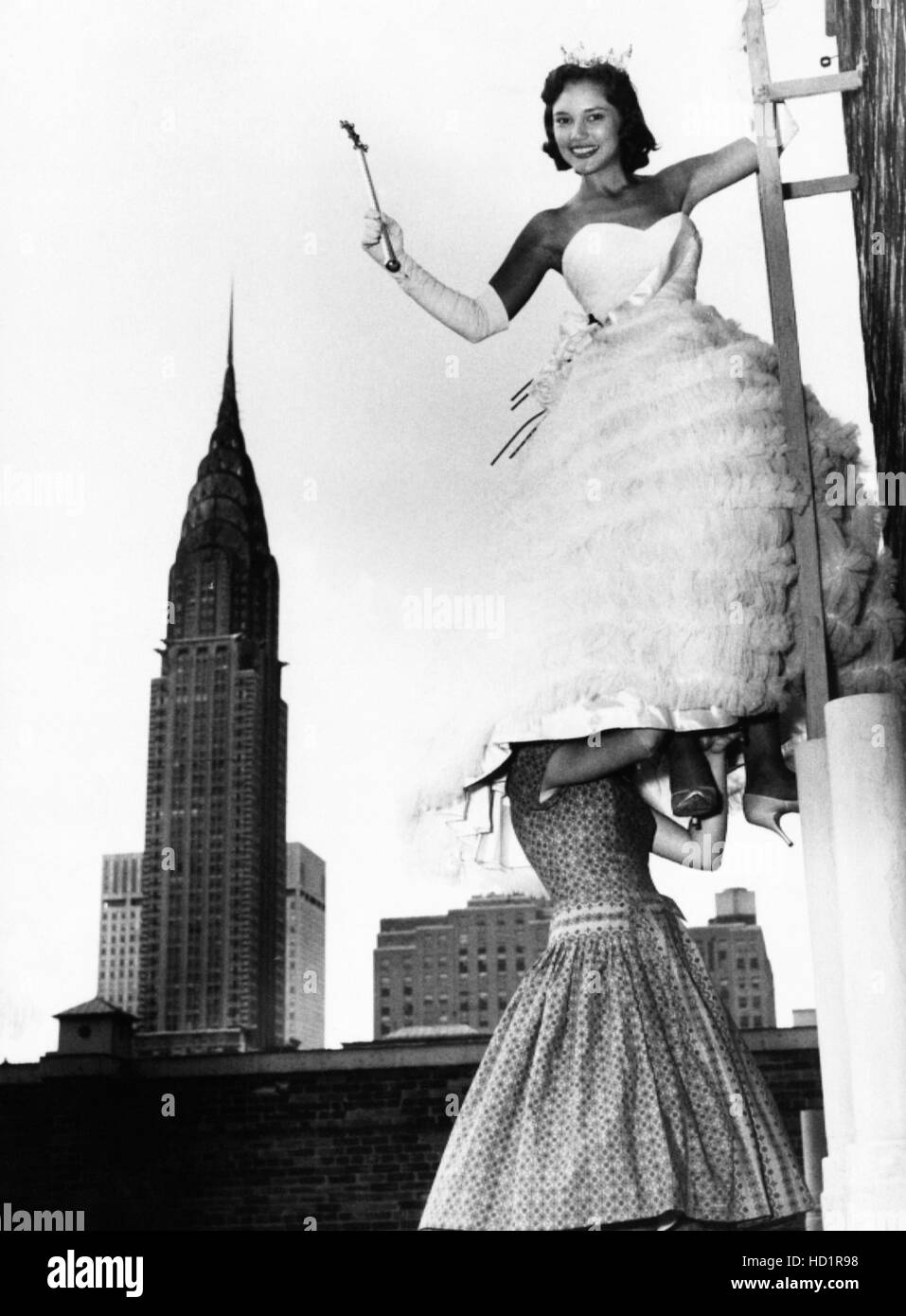 Mary Ann Mobley, Miss America 1959, being assisted on a photo shoot by ...