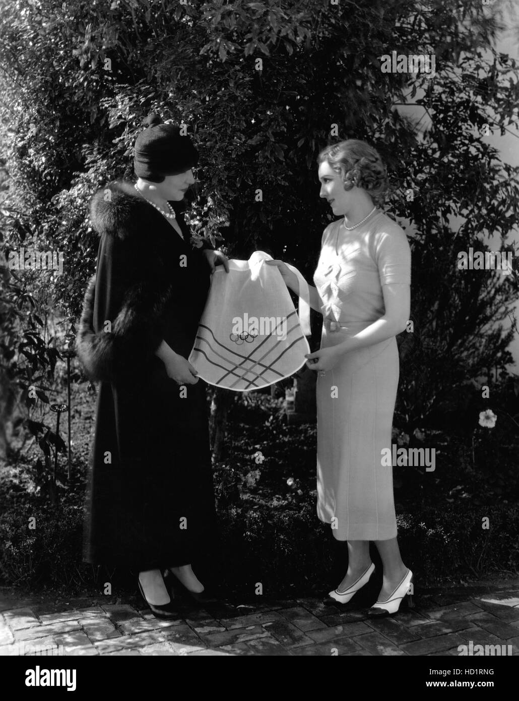 Mrs. Lou Anger, Mary Pickford, introducing the 'Olympic Apron' made by ...