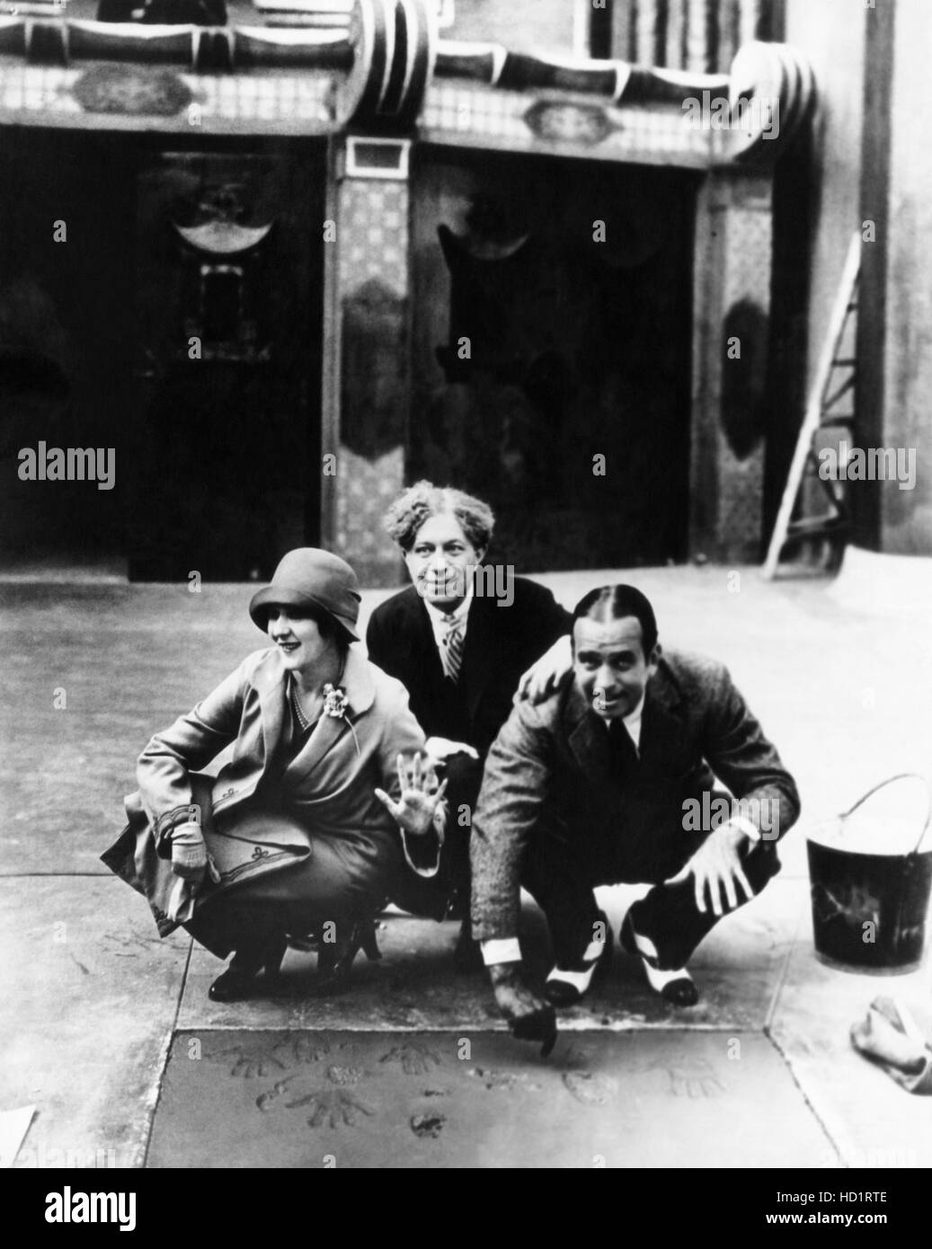 Sid Grauman (center) oversees Mary Pickford (left) and Douglas ...