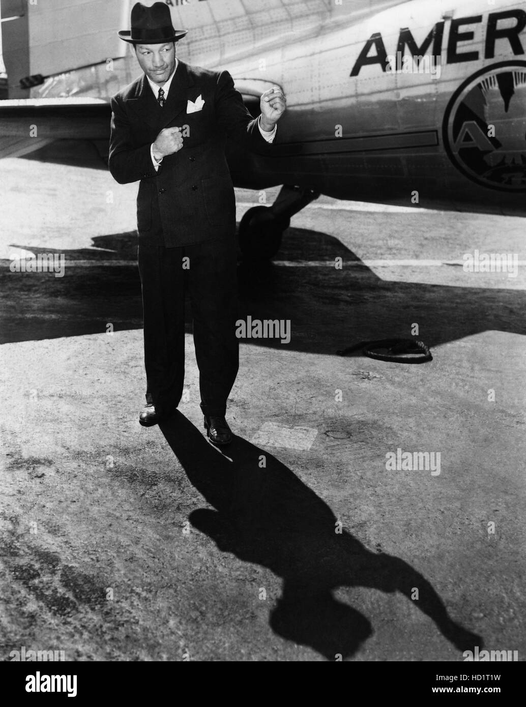 'Slapsie' Maxie Rosenbloom, striking a pose after arriving by plane in ...