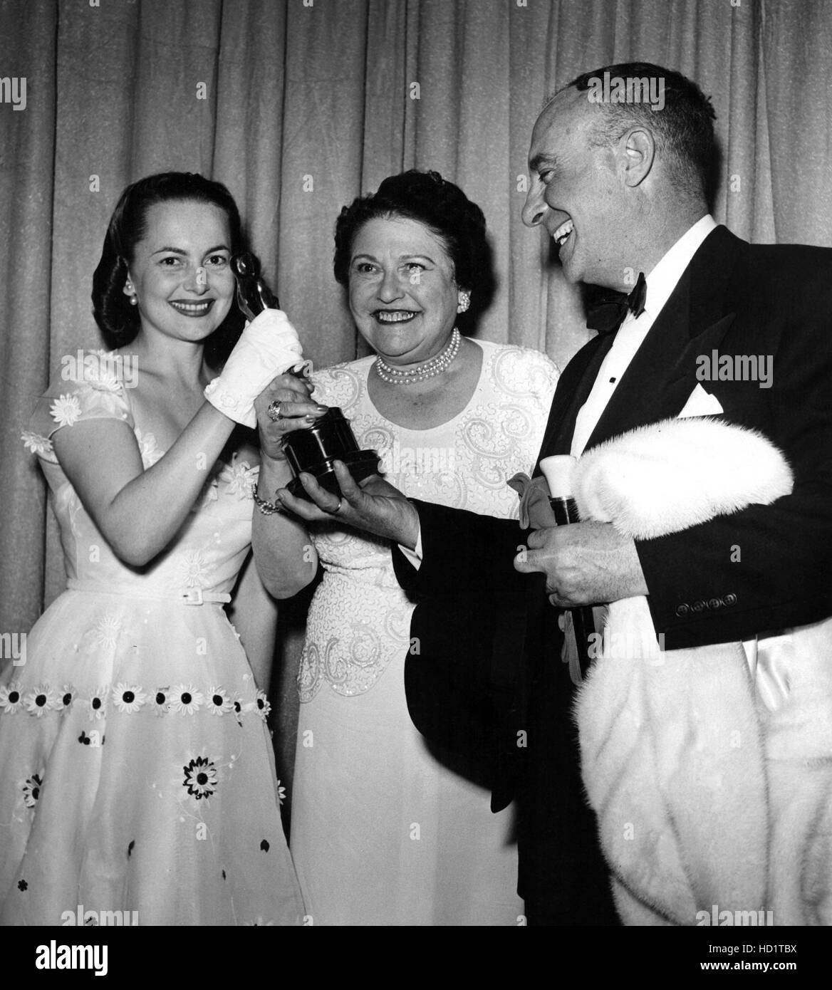 Olivia De Havilland holding her Academy Award for THE HEIRESS with ...
