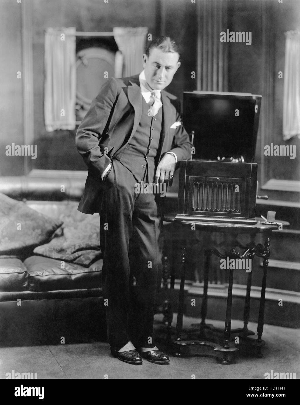 Owen Moore, listening to his record player, ca. early 1920s Stock Photo ...