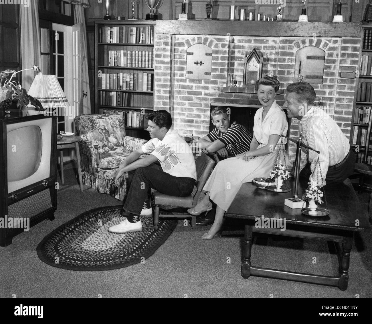 The Nelsons - Rick, Dave, Harriet and Ozzie - watching their own show ...