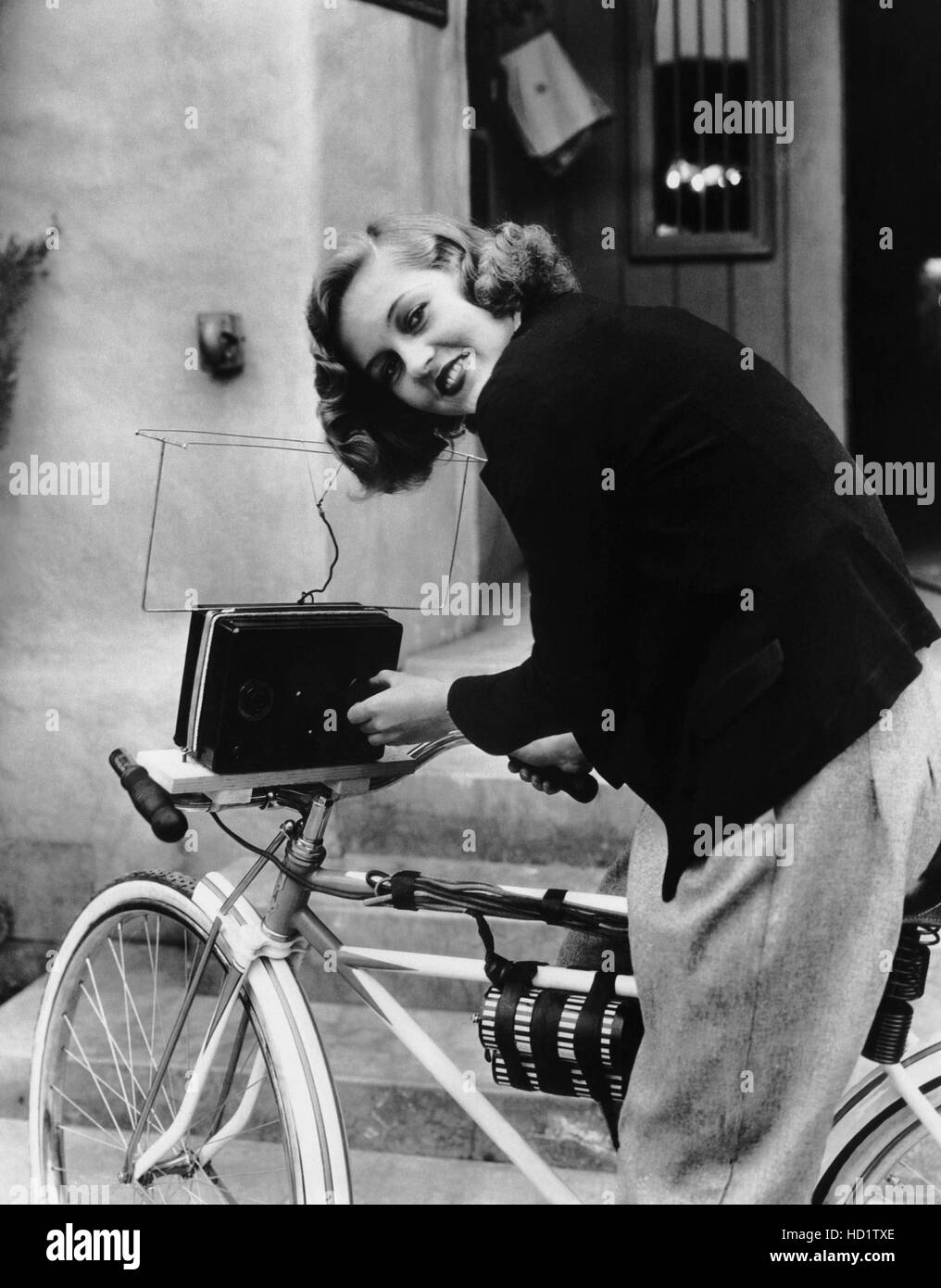 Patricia Ellis, who has equipped her bicycle with a portable radio ...
