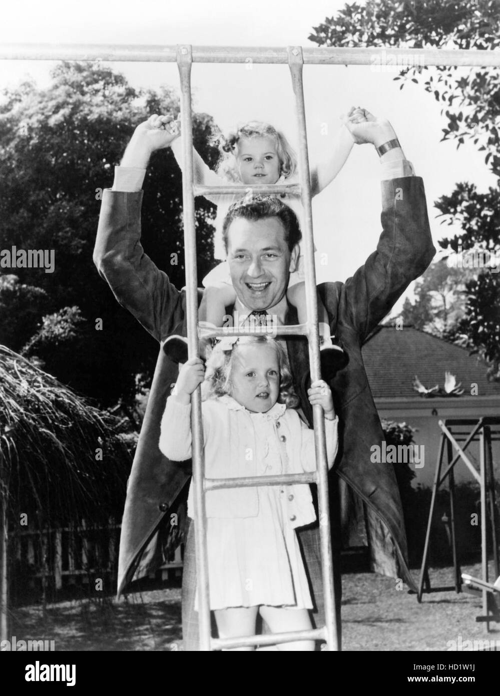 Paul Henreid playing with his daughters Monica and Mimi, 1947 Stock Photo - Alamy